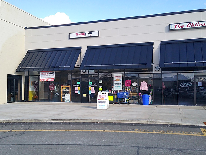The unassuming storefront of Threads of Hope beckons with the promise of hidden treasures behind those black awnings. Thrift nirvana awaits!