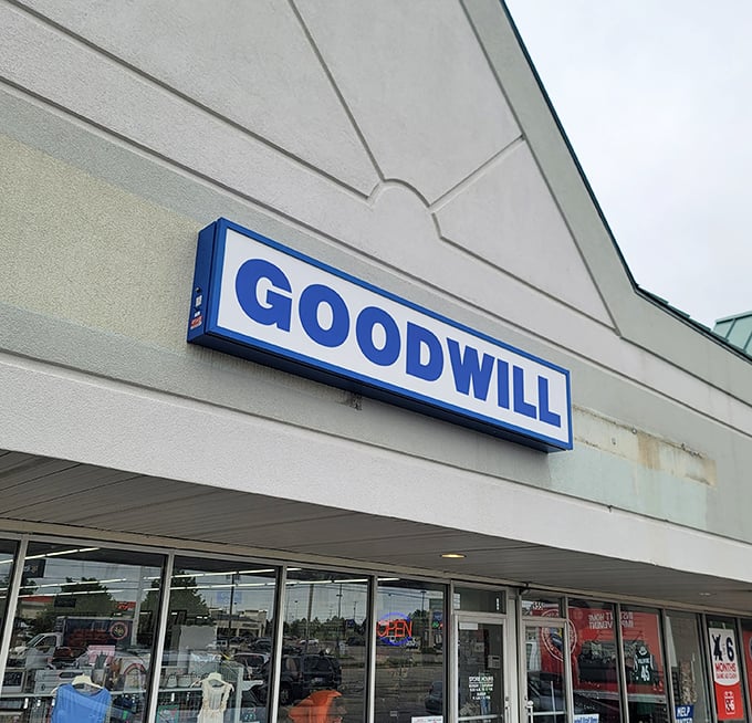 The iconic blue and white Goodwill sign beckons like a lighthouse to bargain hunters navigating the seas of retail. Welcome to treasure island, Jackson-style.
