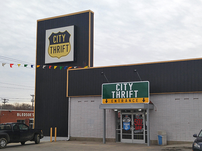 The iconic shield-shaped City Thrift sign welcomes bargain hunters to this Kansas City treasure trove. Like a beacon for the budget-conscious shopper!