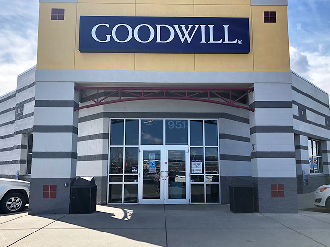 The iconic blue Goodwill sign beckons bargain hunters like a retail lighthouse guiding ships to treasure-filled shores. Welcome to thrift paradise!