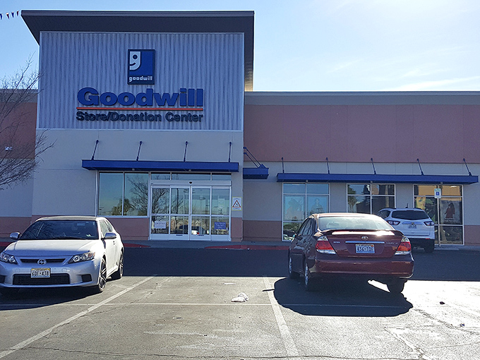 The blue Goodwill sign beckons like a lighthouse to bargain hunters. This Henderson location promises treasure behind those automatic doors.