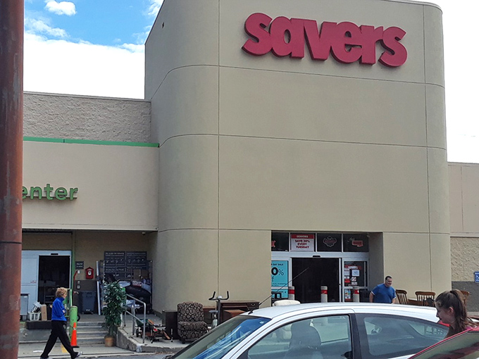 The iconic red Savers sign beckons like a lighthouse for bargain hunters. This unassuming exterior hides a universe of possibilities waiting to be discovered.
