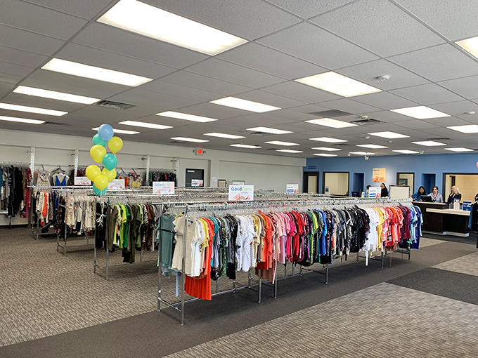 A rainbow of possibilities hangs in perfect formation, each garment whispering, "Take me home and give me a second chance at fashion greatness."