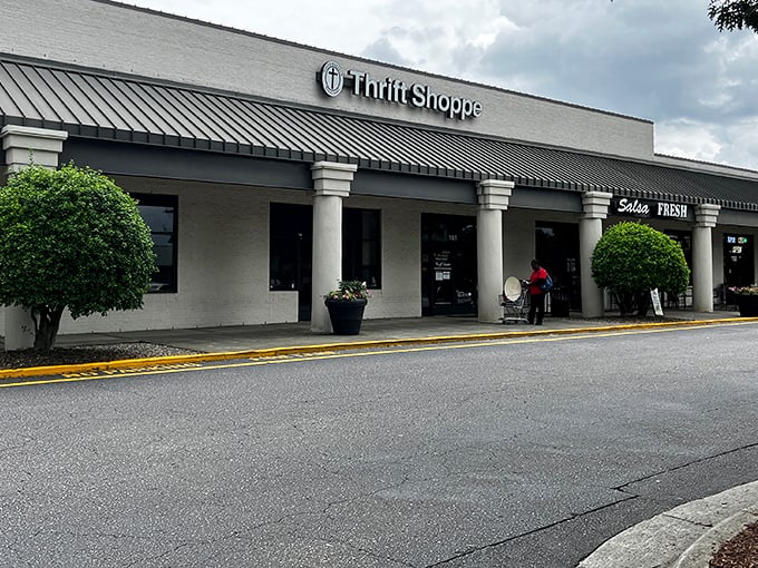 The unassuming storefront of North Raleigh Ministries Thrift Shoppe&mdash;where bargain hunters find treasures hiding in plain sight beneath that classic strip mall awning.