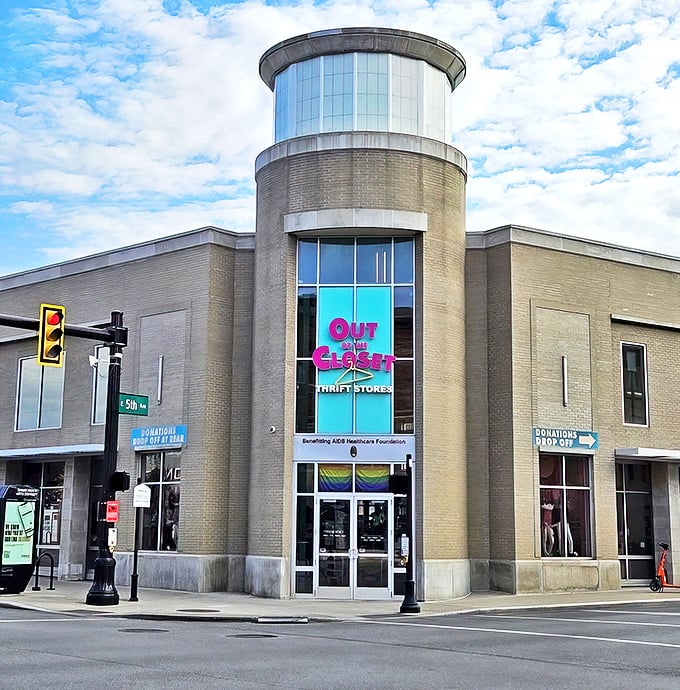 The iconic cylindrical tower entrance of Out of the Closet stands like a beacon of hope and bargains on the corner of High Street and 5th Avenue.