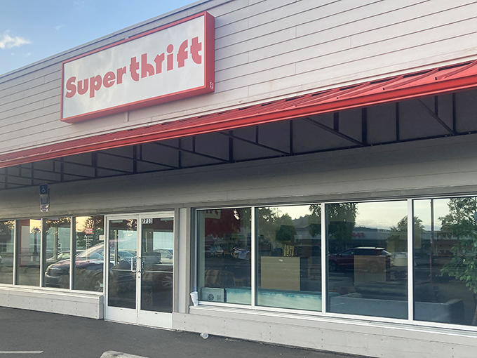 The bright red SuperThrift sign beckons bargain hunters like a retail lighthouse, promising treasures within those sliding glass doors.