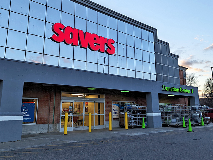 The gleaming glass facade of Savers in Warwick stands like a cathedral to second-hand treasures, its red signage a beacon to bargain hunters everywhere.