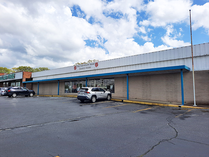 The unassuming exterior of Salvation Army's Greenville location – where treasure hunting begins beneath South Carolina skies. No fancy frills, just the promise of undiscovered gems waiting inside.