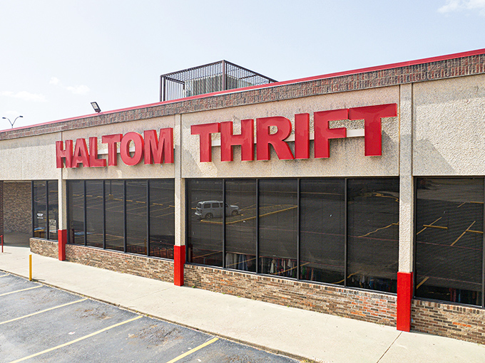 The red lettering of Haltom Thrift beckons like a siren song to bargain hunters across Fort Worth. This unassuming exterior houses treasures beyond imagination.