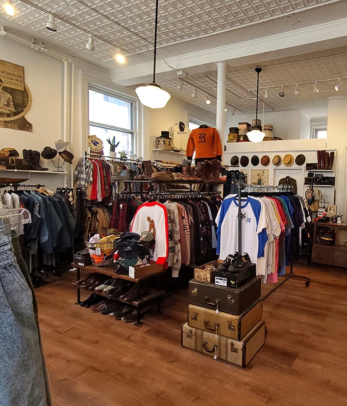 Step into this time-traveling fashion wonderland where vintage treasures await beneath classic pressed tin ceilings and warm wooden floors.