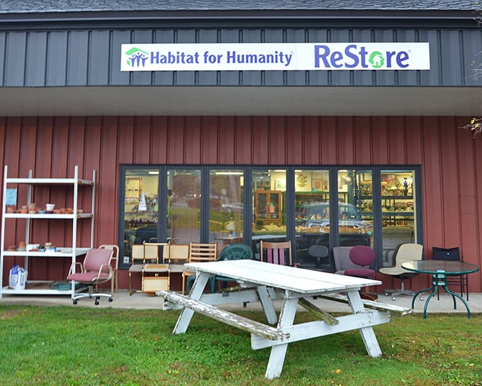 Look closely at that outdoor display: chairs, shelving, and a weathered picnic table all seeking their next adventure at prices that make sense.