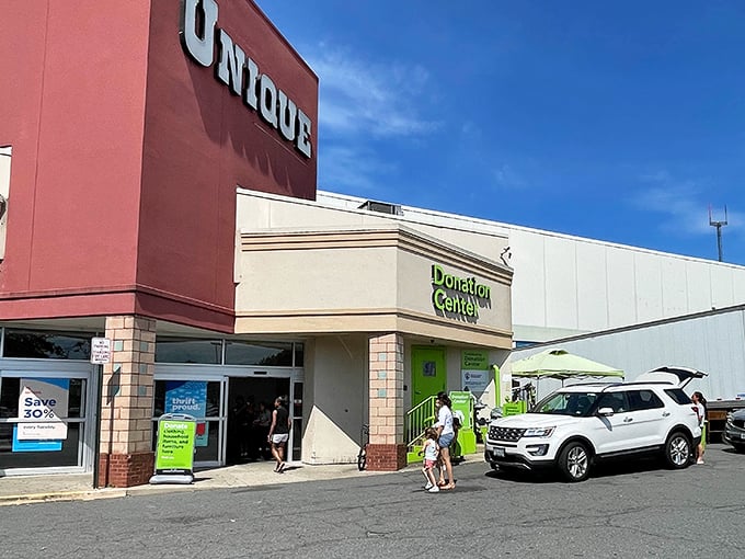 The iconic red Unique sign stands like a beacon for bargain hunters, promising treasures within that won't break the bank.