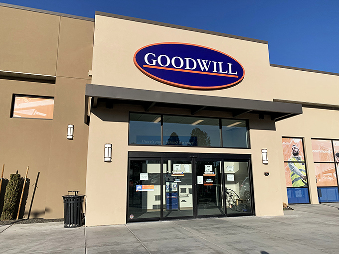 The iconic blue oval sign beckons like a lighthouse for bargain hunters, promising treasures within this unassuming beige building.