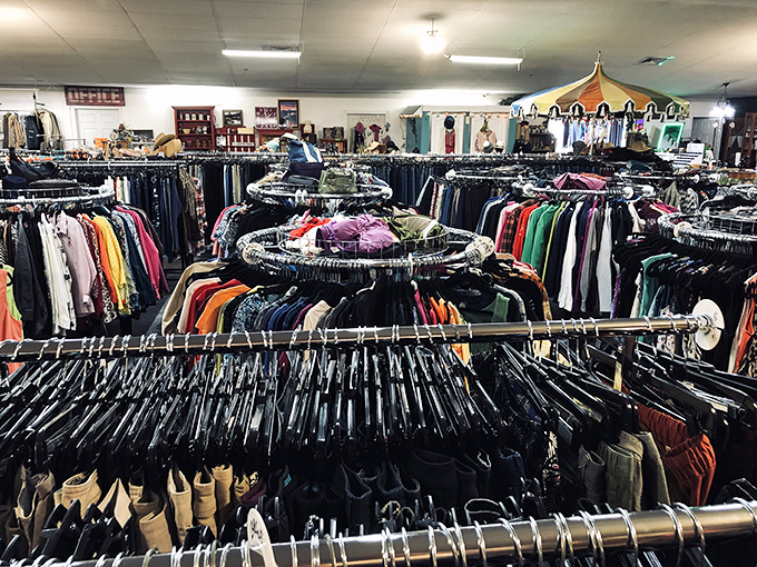 Welcome to the promised land! Circular racks stretch to the horizon at Deja Vu Thrift Store, where bargain hunters find their happy place.