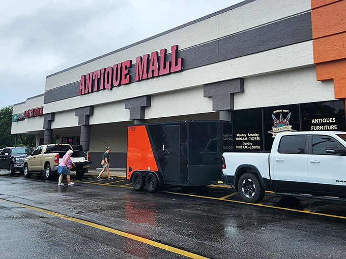 The iconic red lettering of Lakeland Antique Mall beckons treasure hunters like a siren song on a rainy Florida afternoon.