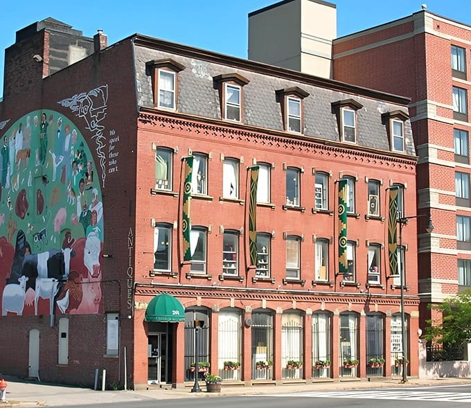 The historic brick building housing Cambridge Antique Market stands proudly on the corner, its colorful mural hinting at the creative treasures waiting inside.