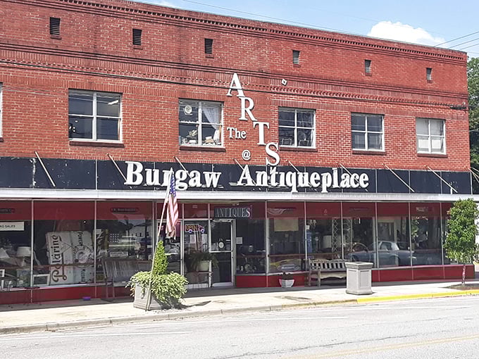The iconic red brick fa&ccedil;ade of Burgaw Antique Place stands like a time portal on Main Street, beckoning curious souls to step back into yesterday.