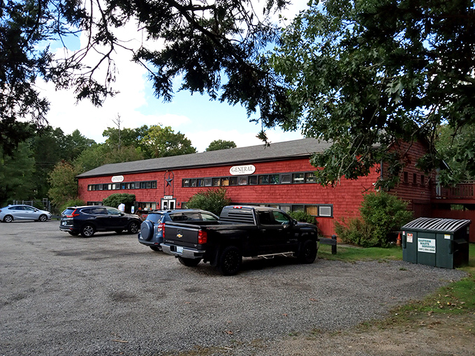 The iconic red barn exterior of Jules Antiques beckons treasure hunters with the promise of discoveries that big-box stores could never deliver.
