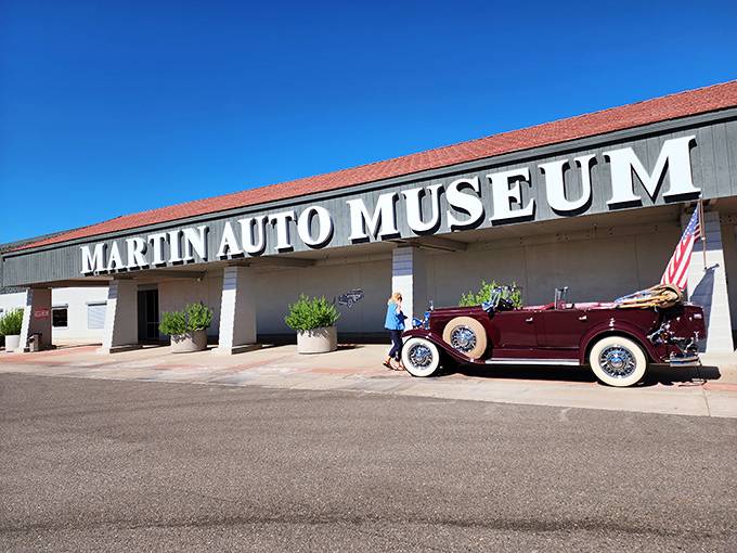 The Martin Auto Museum stands proudly under Arizona's blue sky, where automotive dreams come with white-wall tires and chrome that blinds in the desert sun.