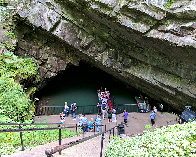 Penn's Cave&rsquo;s mysterious entrance, where adventure begins amid the emerald-tinted waters waiting inside.