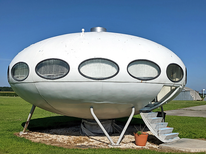 The Futuro House stands like a retro-futuristic sentinel against Delaware's blue skies, its oval windows watching for visitors from this world and beyond.