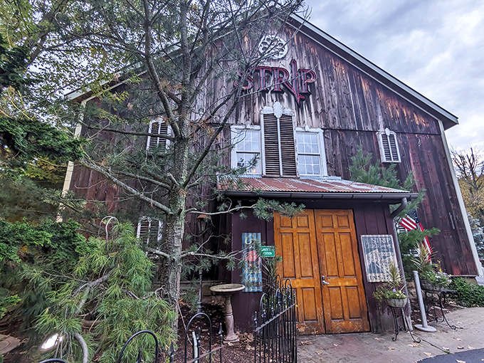 Not just any barn in Ohio &ndash; this weathered wooden beauty houses Strip Steakhouse, where rustic charm meets culinary excellence behind those inviting golden doors.