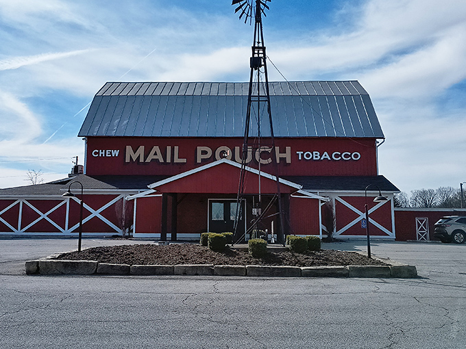 The iconic red barn exterior with its windmill and vintage "Mail Pouch Tobacco" sign stands as a beacon for hungry travelers&mdash;rural Americana at its most delicious.