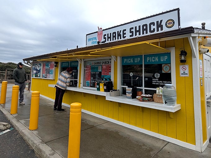 The cheerful yellow exterior of Crystal Cove Shake Shack stands like a beacon of hope for hungry travelers along PCH. Simplicity never looked so inviting.