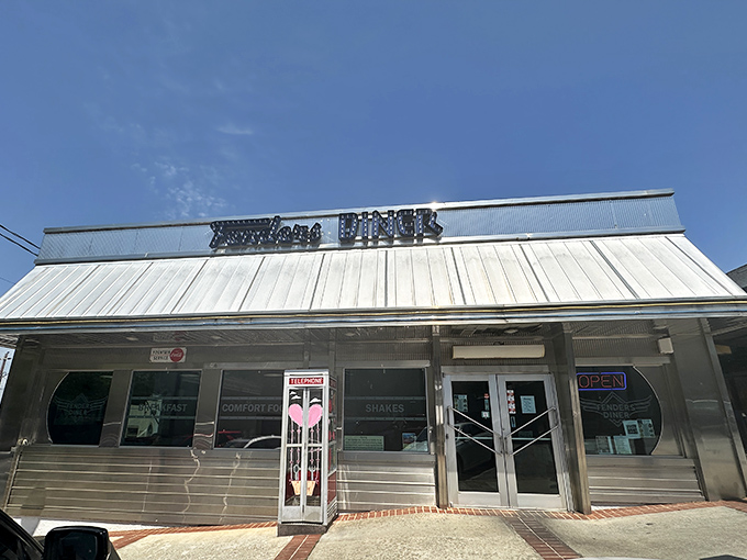 As dusk settles over Cornelia, Fenders Diner transforms into a neon-lit beacon of comfort food that practically whispers, "Yes, we're worth the calories."