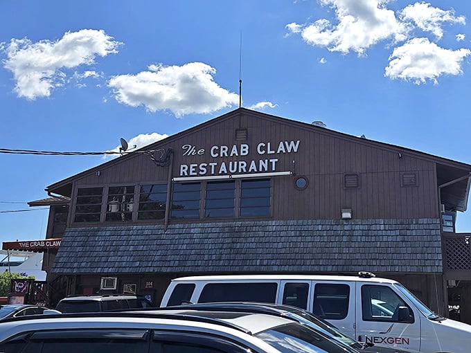 The Crab Claw's unassuming wooden exterior belies the seafood treasures within&mdash;Maryland's crab cake paradise under perfect blue skies.