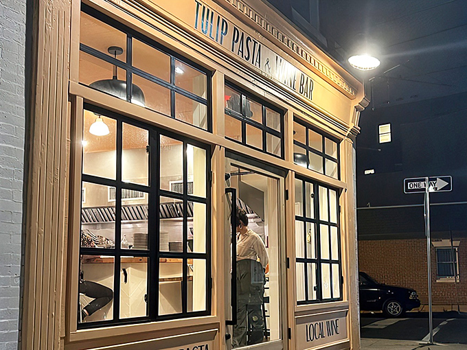 The golden glow of Tulip's storefront beckons like a lighthouse for pasta pilgrims. Philadelphia's hidden gem shines brightest after dark.