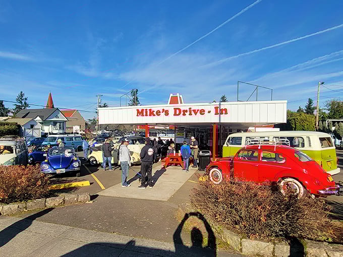 The classic red-roofed silhouette of Mike's Drive-In stands as a time capsule of Americana, where burgers and nostalgia are served in equal measure.