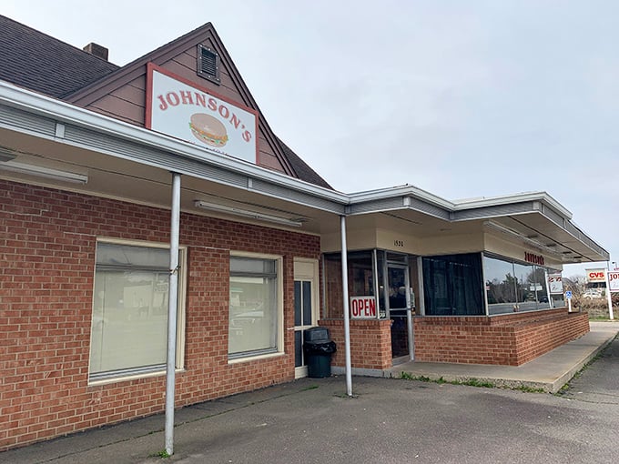 The humble brick exterior of Johnson's Drive-In belies the burger magic happening inside. No fancy frills needed when you've perfected the cheeseburger.