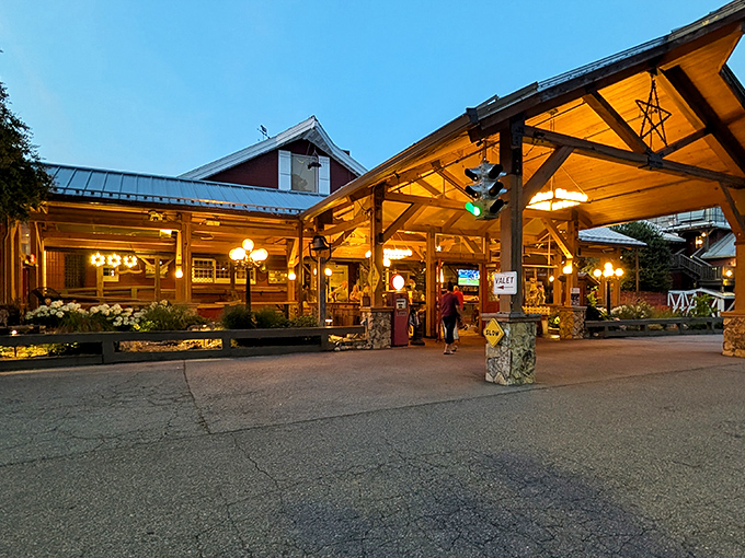 The iconic red exterior of Angus Barn glows at dusk, beckoning hungry travelers like a carnivorous North Star guiding meat lovers home.