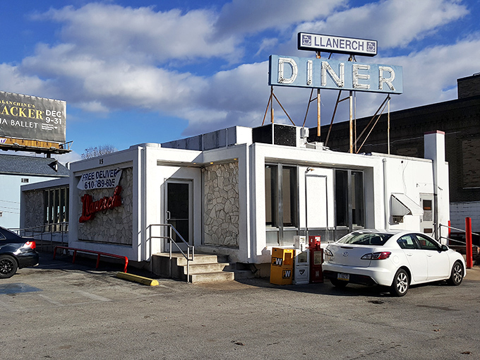 The iconic Llanerch Diner sign stands proud against the Pennsylvania sky, a beacon of comfort food that's been calling hungry patrons home for generations.