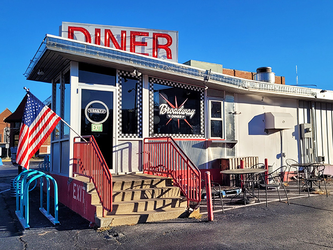 The classic American dream served sunny-side up! Broadway Diner's iconic red sign and checkered facade promise pancake perfection under the Missouri sky.