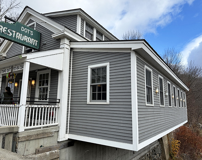 Quintessential Vermont charm in gray clapboard and white trim. Dot's Restaurant stands ready to welcome hungry travelers with its inviting front porch.