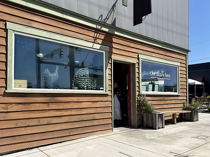 The unassuming wooden exterior of The Dizzy Hen belies the culinary magic happening inside. Small-town charm with big-city flavor awaits behind that red door.