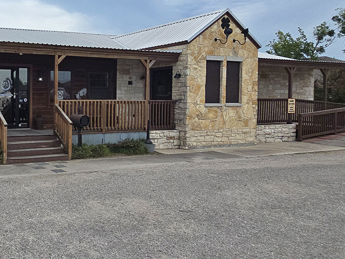 The rustic wooden exterior of Good Luck Grill beckons like an old friend, promising comfort food treasures behind that charming porch railing. 