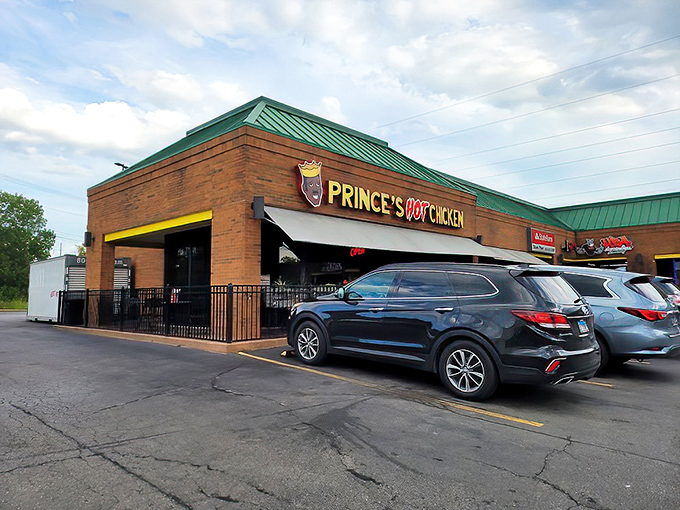 The iconic Prince's Hot Chicken sign beckons like a spicy siren call, promising a Nashville heat experience that'll have you sweating with joy.