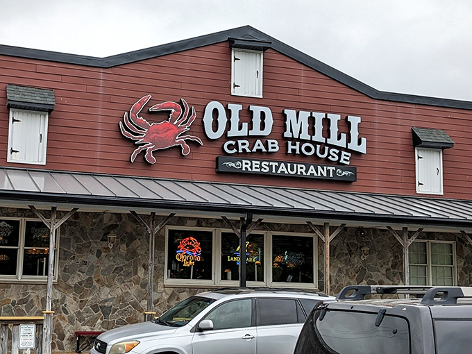 The iconic red crab sign beckons seafood lovers like a maritime lighthouse. This rustic exterior promises treasures from the deep within.