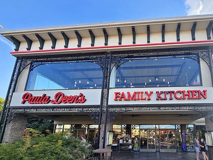 The gleaming facade of Paula Deen's Family Kitchen stands like a beacon of butter-based hope in Pigeon Forge's Island entertainment complex.