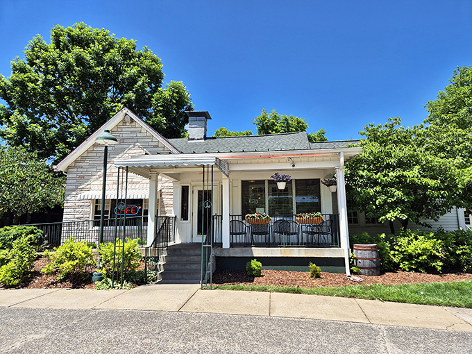 The charming white clapboard exterior welcomes hungry travelers like an old friend promising comfort food salvation just ahead.