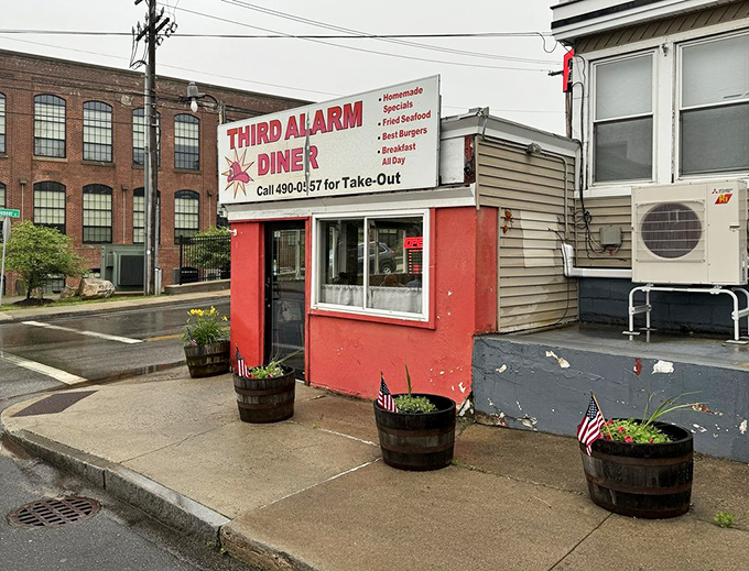 The bright red exterior of Third Alarm Diner stands out like a beacon for hungry travelers&mdash;firefighter theme already stoking appetites!