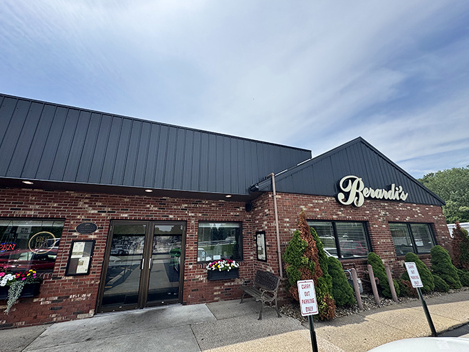 The classic brick-and-navy exterior of Berardi's stands as a beacon of culinary promise in Huron, where the elegant script signage has welcomed hungry patrons for decades.
