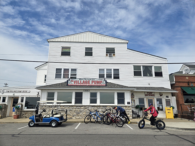The white clapboard exterior of The Village Pump stands like a culinary lighthouse on Kelleys Island, beckoning hungry travelers with promises of Lake Erie's finest.