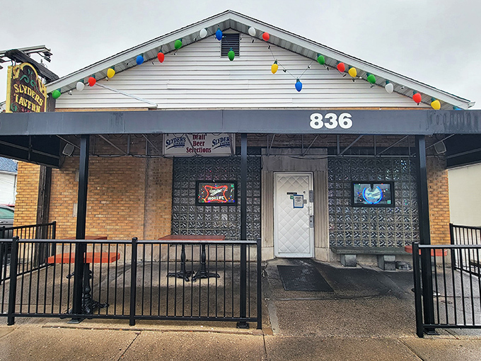 Festive string lights adorn Slyder's humble facade, like a neighborhood friend who's always dressed for a party. The unassuming entrance hides culinary treasures within.