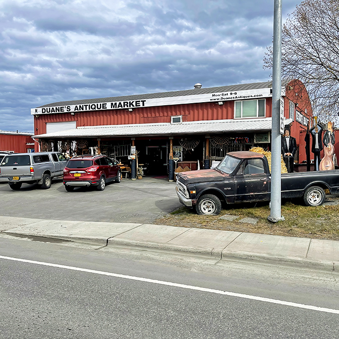 The iconic rust-red exterior of Duane's Antique Market stands like a beacon for treasure hunters against Anchorage's often-gray skies.