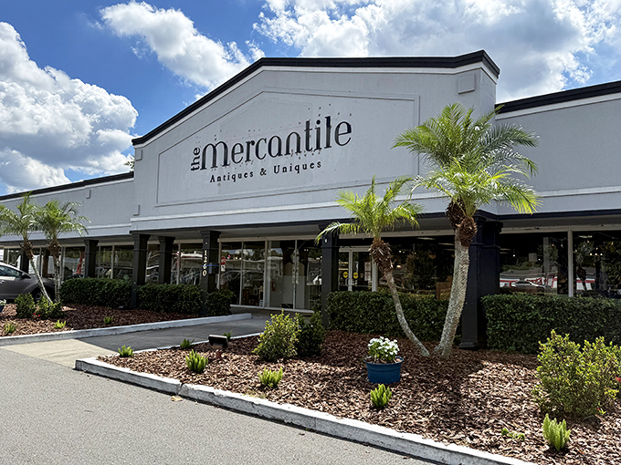 The Mercantile's pristine white exterior belies the colorful chaos of treasures within—like finding a pirate's chest disguised as a suburban bank.