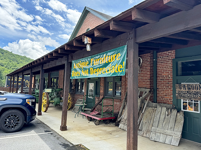 The brick facade and wooden overhang of this former train depot now whispers tales of treasures within. That banner isn't kidding about antique furniture's value!